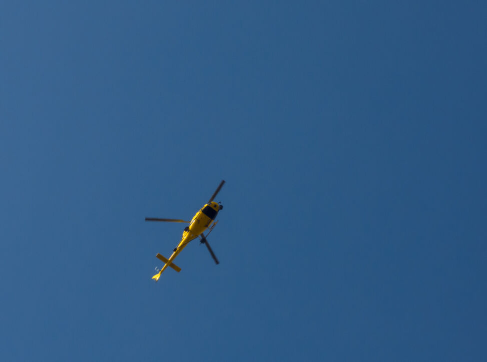 Yellow helicopter against the blue sky | Copyright-free photo (by M ...