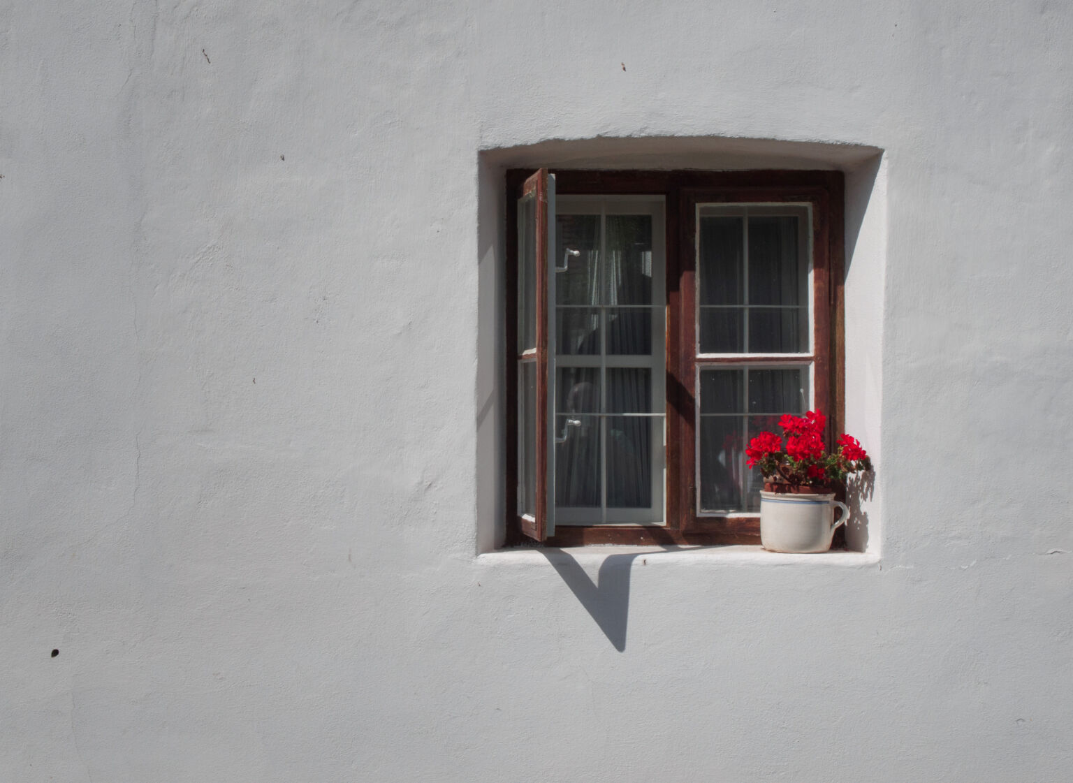 Vintage window with red flowers on white wall | Copyright-free photo ...