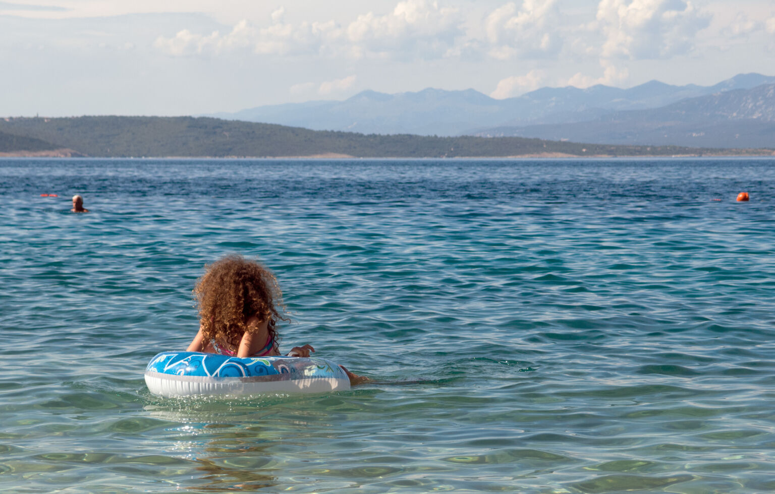 A Girl On Inflatable Ring In The Sea | Copyright-free photo (by M ...
