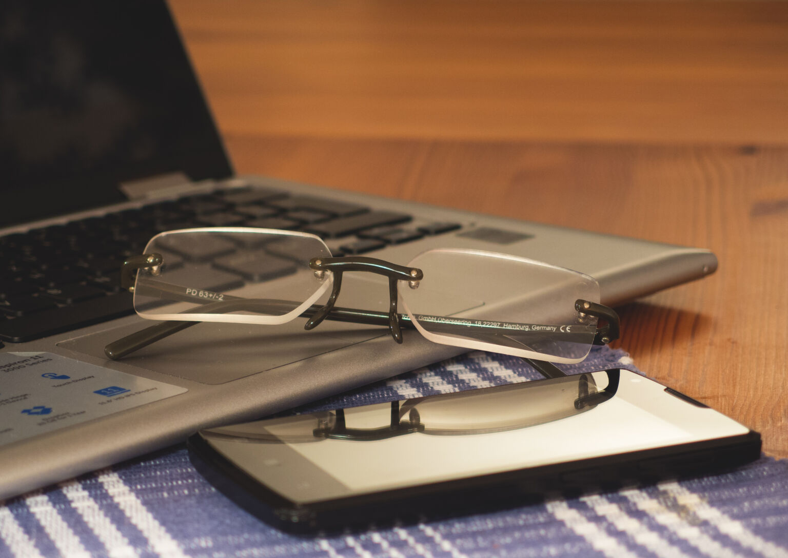 Glasses, Laptop And Phone On The Office Desk | Copyright-free photo (by ...